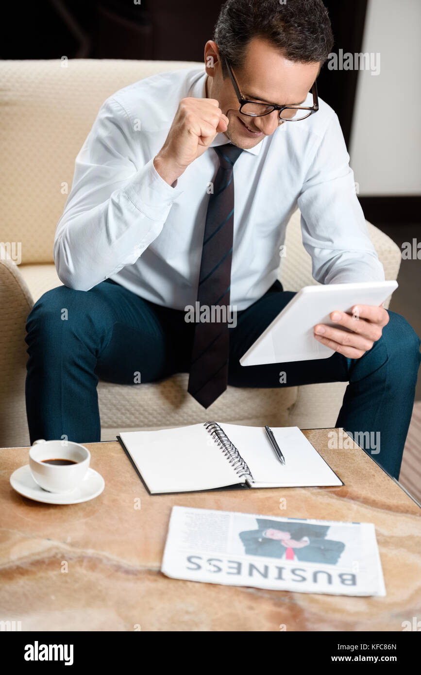 Businessman working with tablet Stock Photo - Alamy