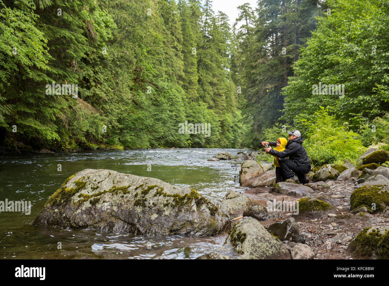 USA, Oregon, Santiam River, Brown Cannon, young boys learning how to ...