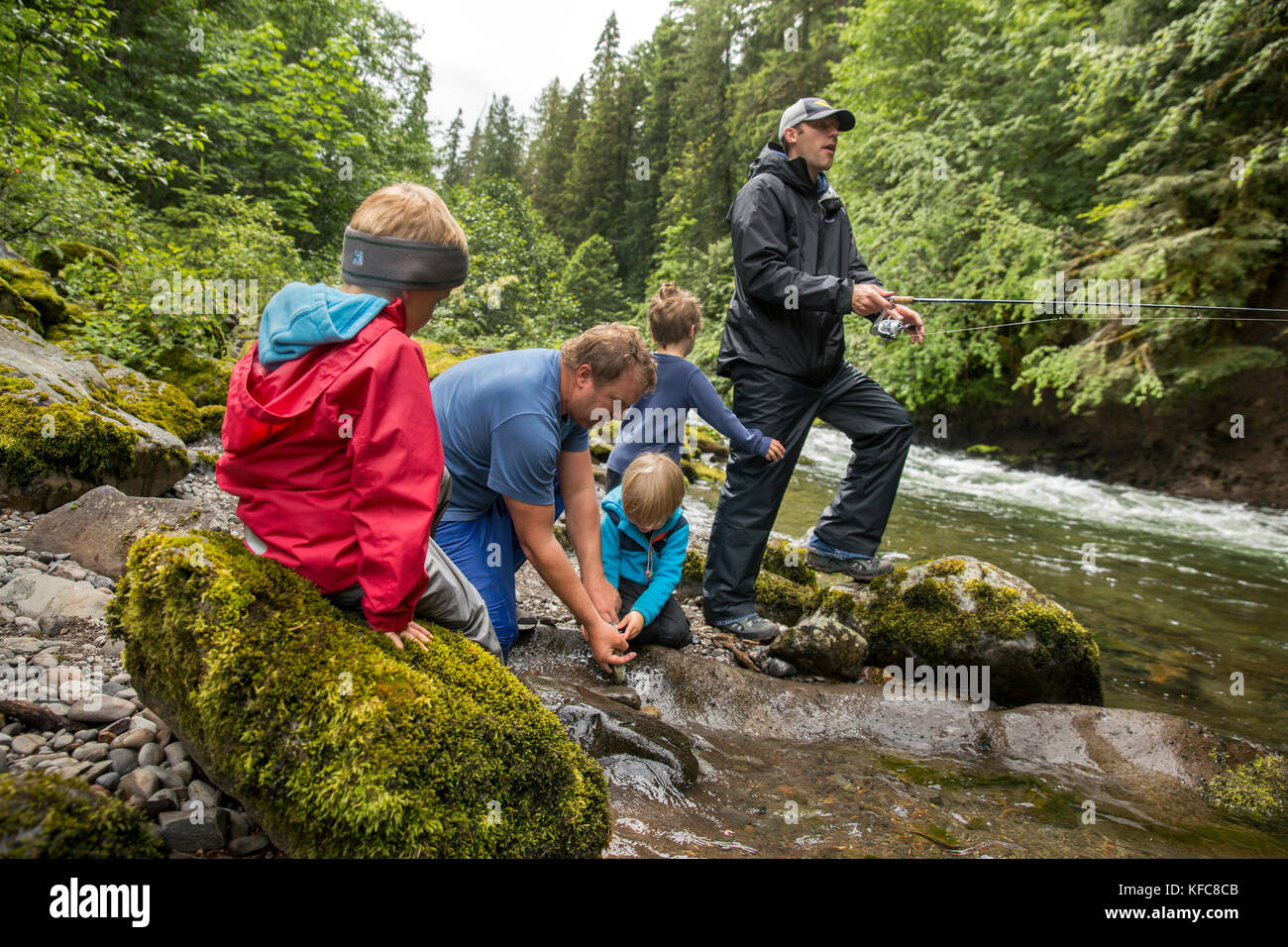 USA, Oregon, Santiam River, Brown Cannon, young boys learning how to ...