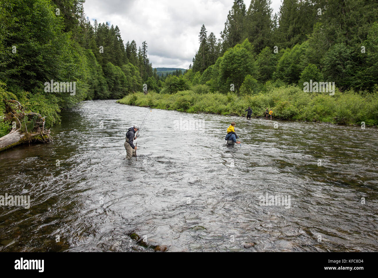 USA, Oregon, Santiam River, Brown Cannon, a group of dads and sons ...
