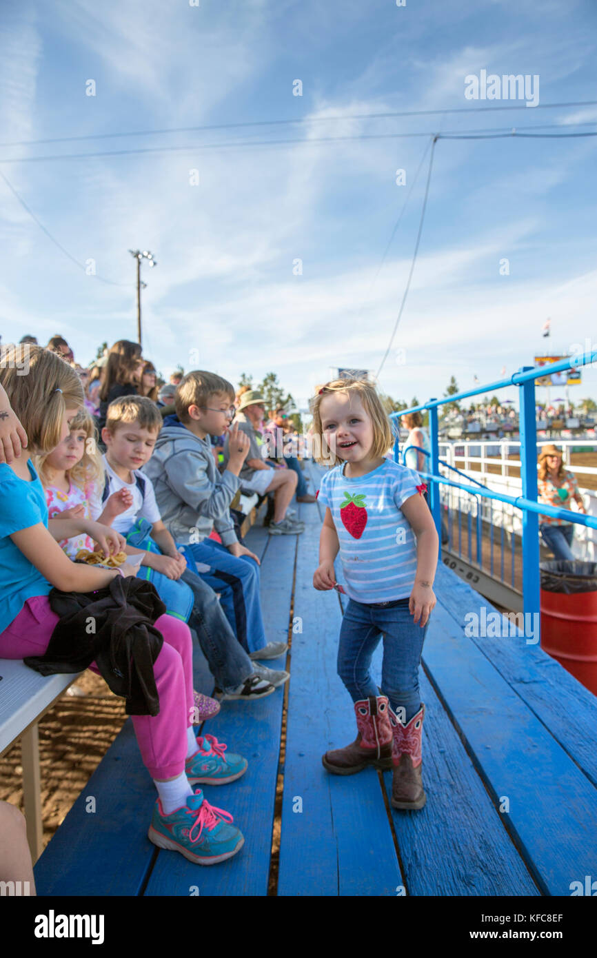 USA, Oregon, Sisters, Sisters Rodeo, children watching the events at ...