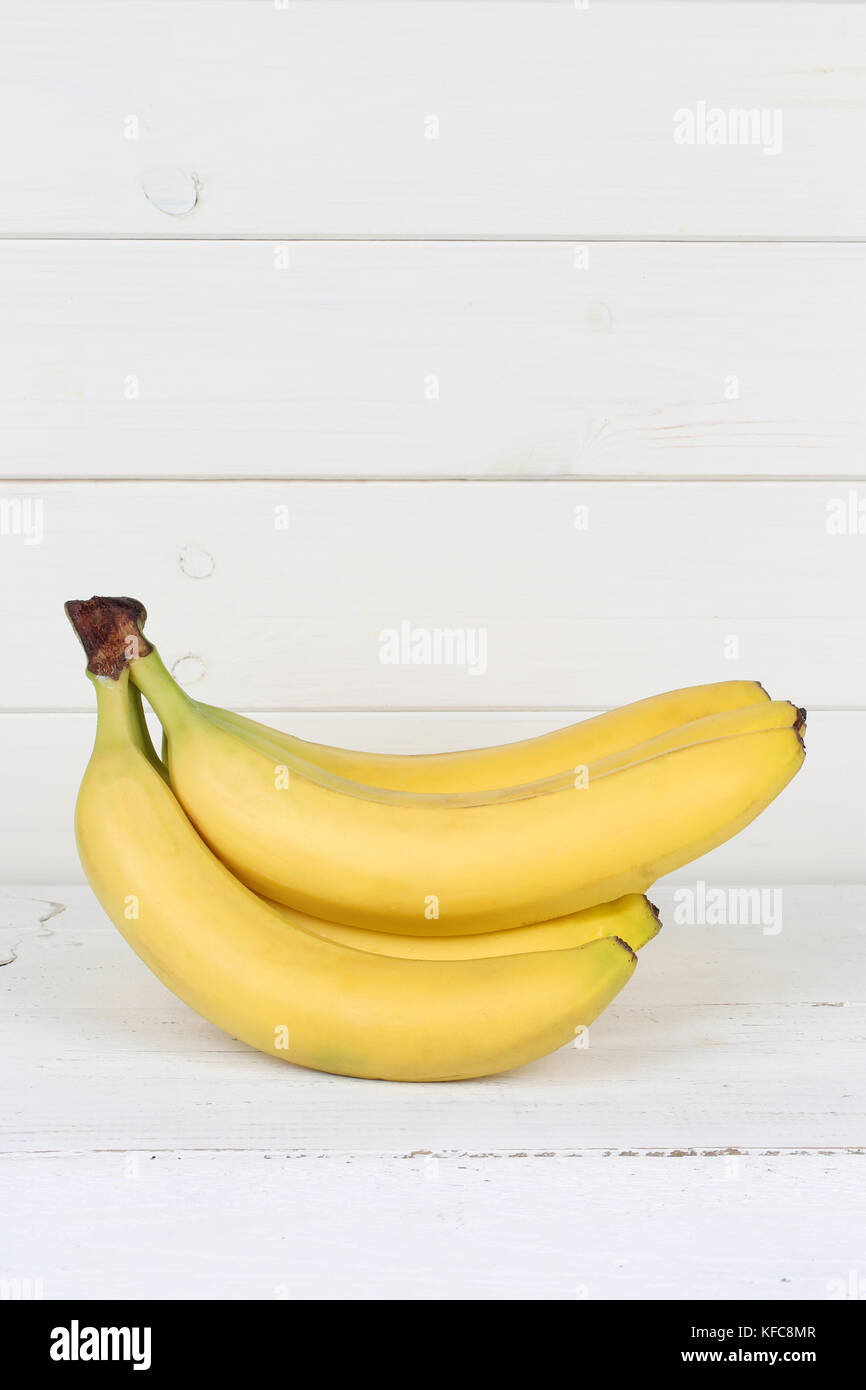 Bananas fruit fruits portrait format copyspace on wooden board wood ...