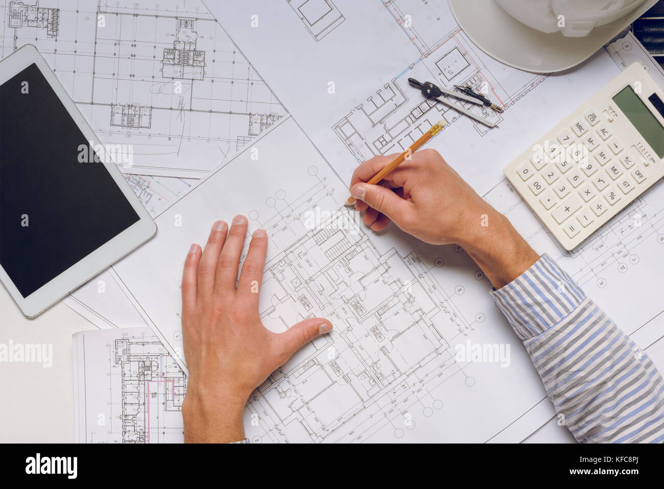 architect working with blueprints Stock Photo - Alamy