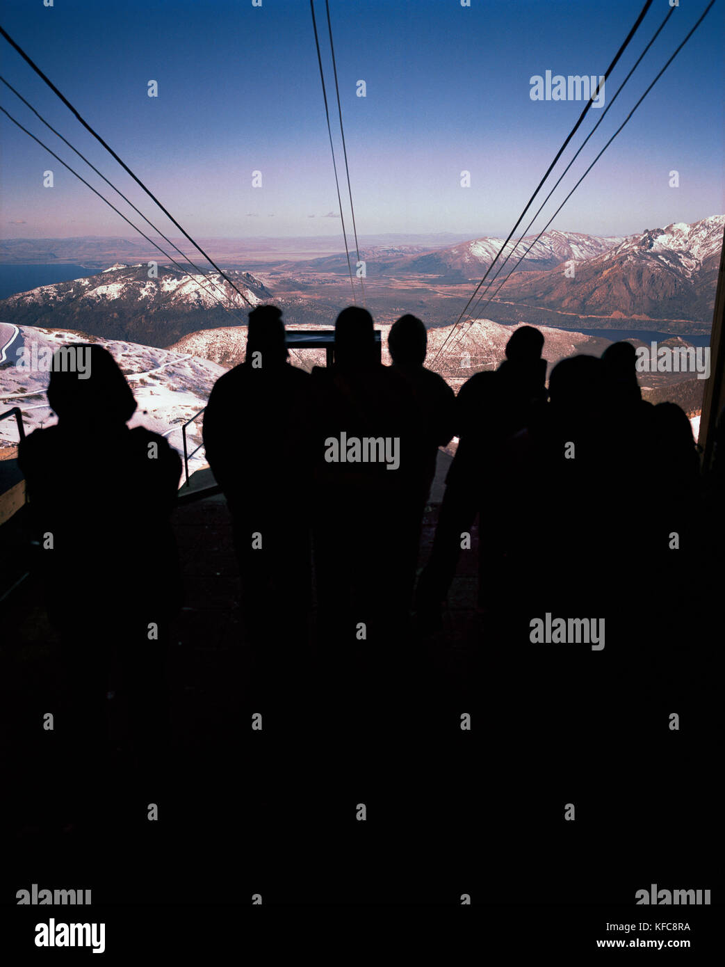 ARGENTINA, Bariloche, Cerro Cathedral, silhouetted of people traveling ...