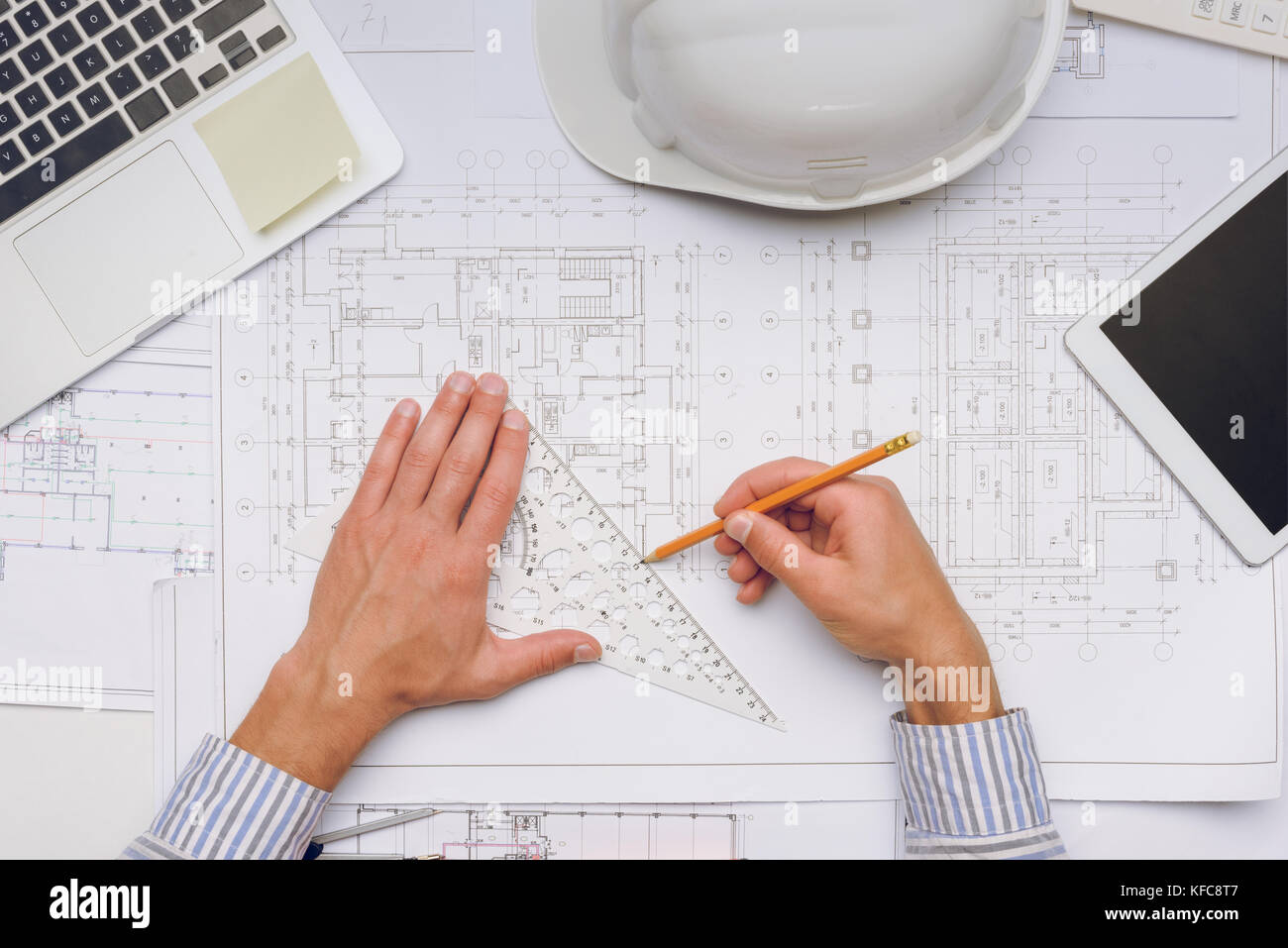 architect working with blueprints Stock Photo - Alamy