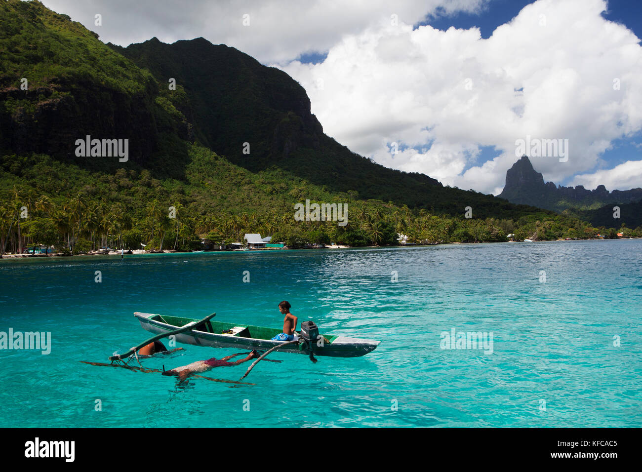 FRENCH POLYNESIA, Moorea Island. A family spearfishing at Opunohu Bay ...