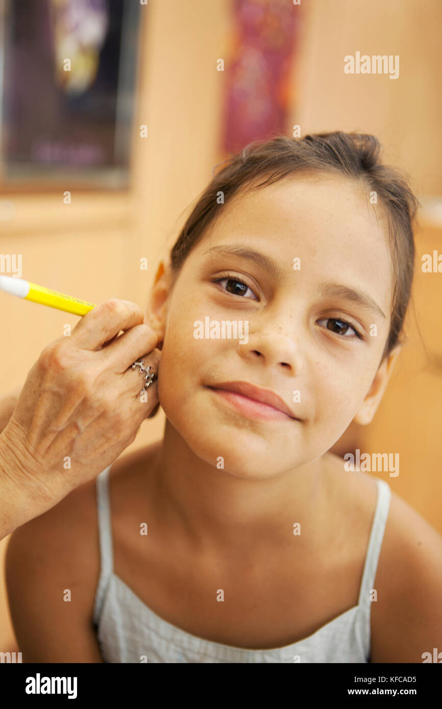 Child getting ears pierced hi-res stock photography and images - Alamy