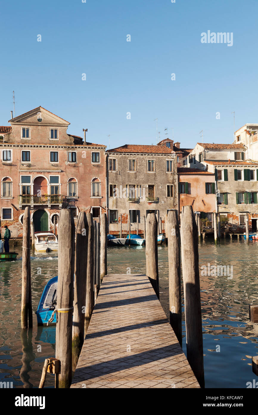 ITALY, Venice. A boat dock along a canal in the Castello distict ...