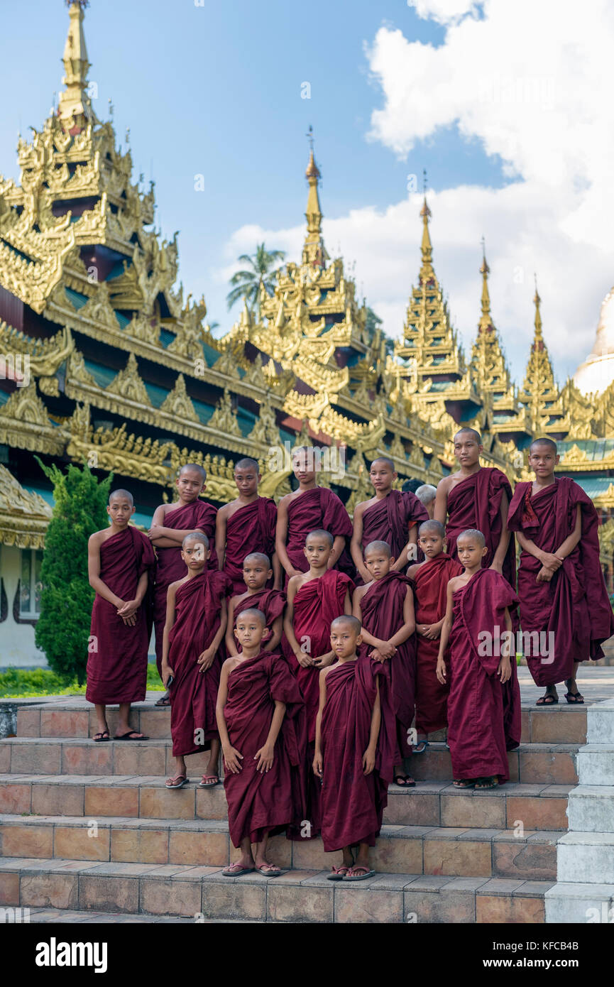 Myanmar (formerly Burma). Yangon. (Rangoon). Young monks in front of ...