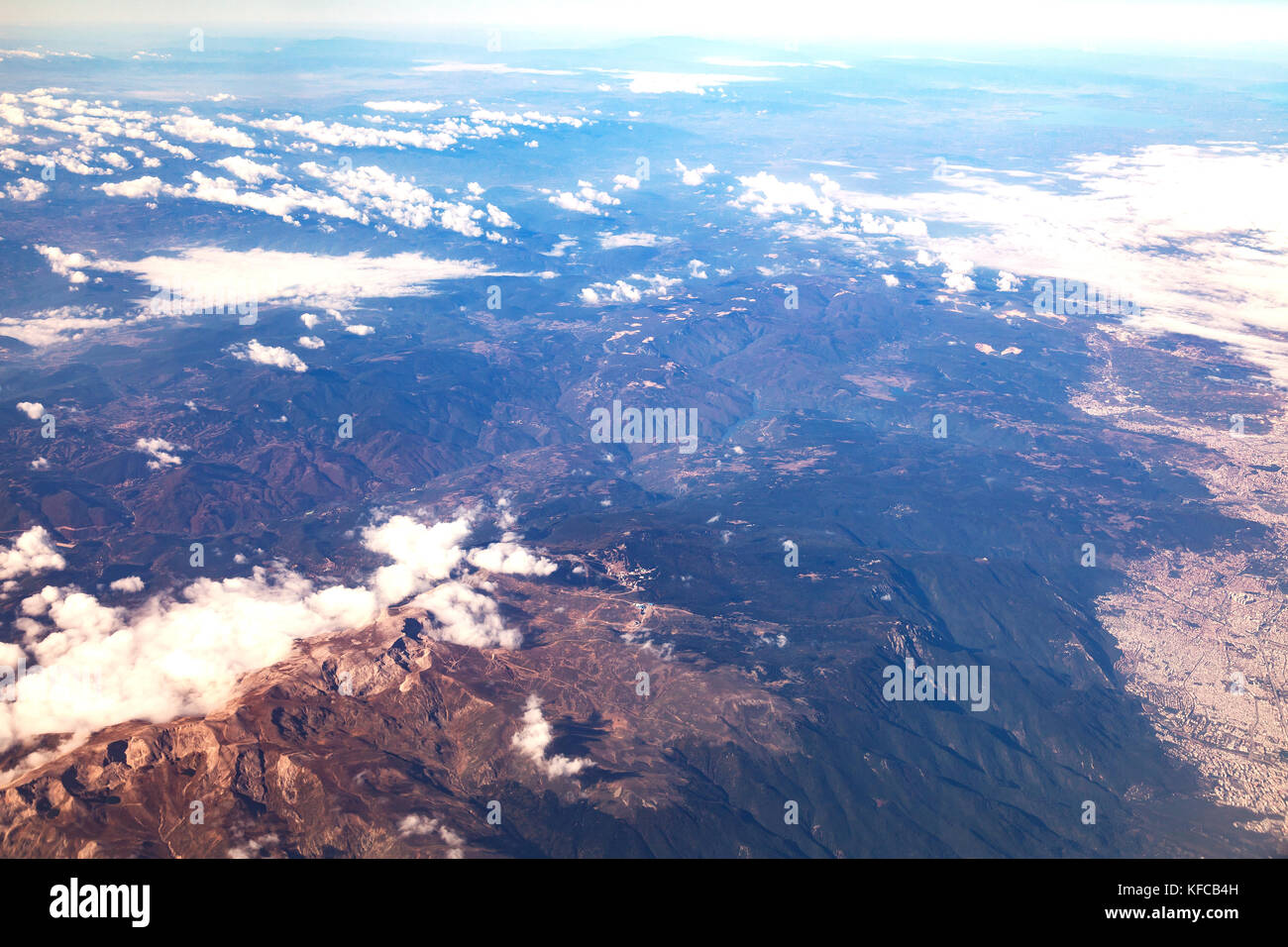 Flight by plane over the mountains of Turkey. Pure blue sky Stock Photo ...