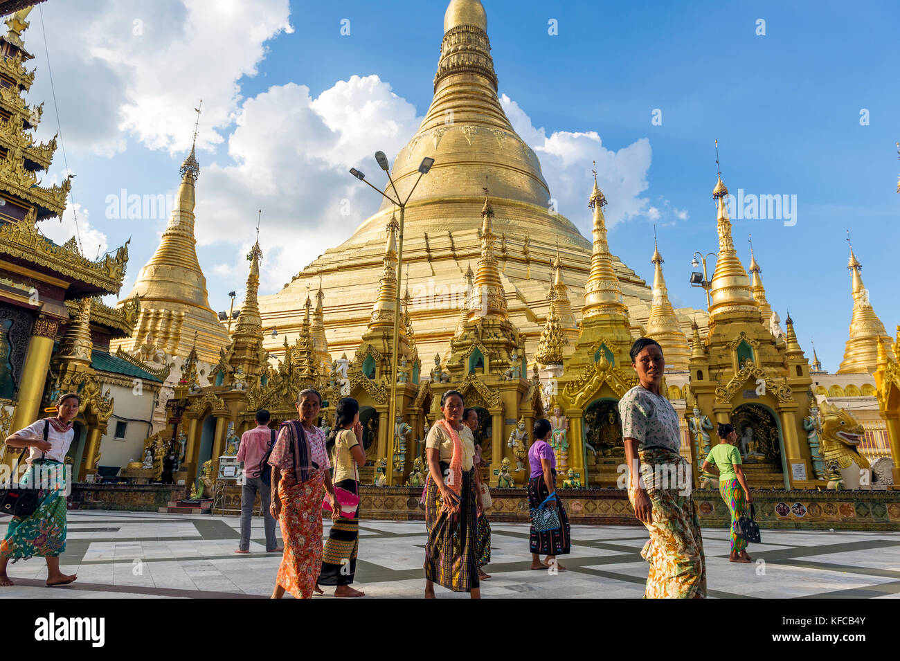 Myanmar (formerly Burma). Yangon. (Rangoon). People walking at ...
