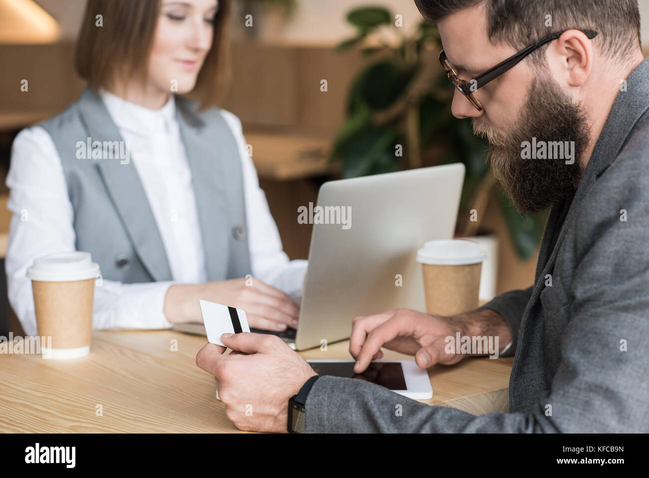 business partners coworking in cafe Stock Photo - Alamy