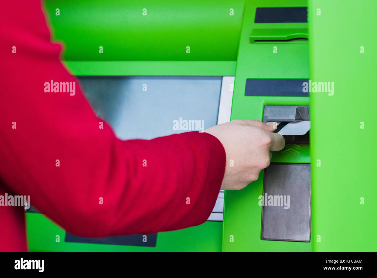putting credit card into atm Stock Photo - Alamy