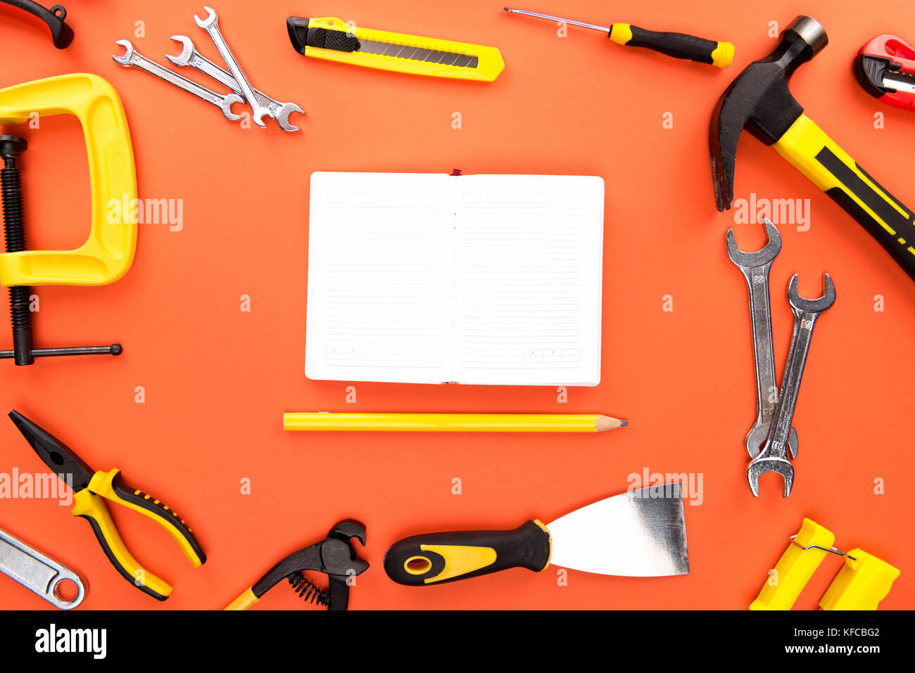 open notebook and reparement tools Stock Photo - Alamy