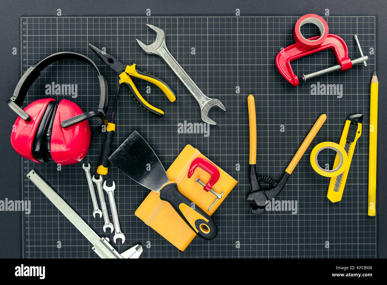 Reparement tools on graph paper Stock Photo - Alamy