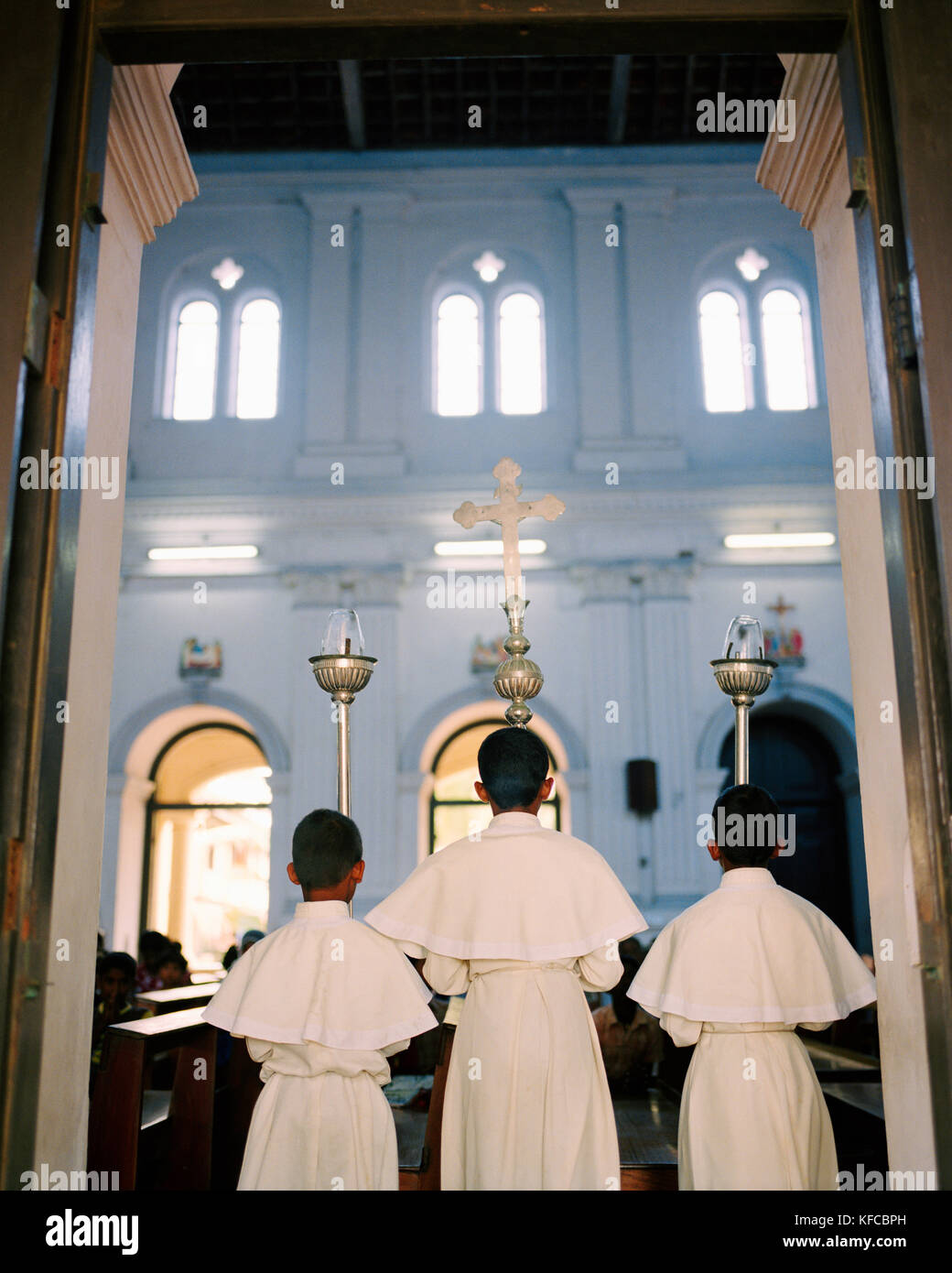 Altar boys carrying cross church hi-res stock photography and images ...