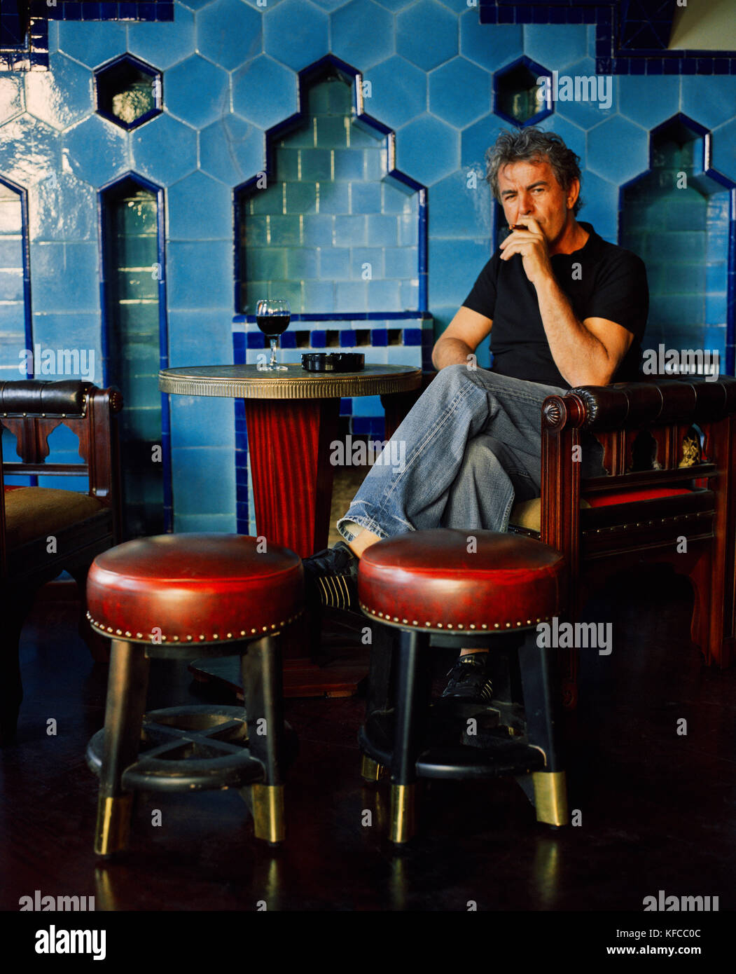 TURKEY, Istanbul, portrait of a mid adult man smoking cigar in Zihni ...
