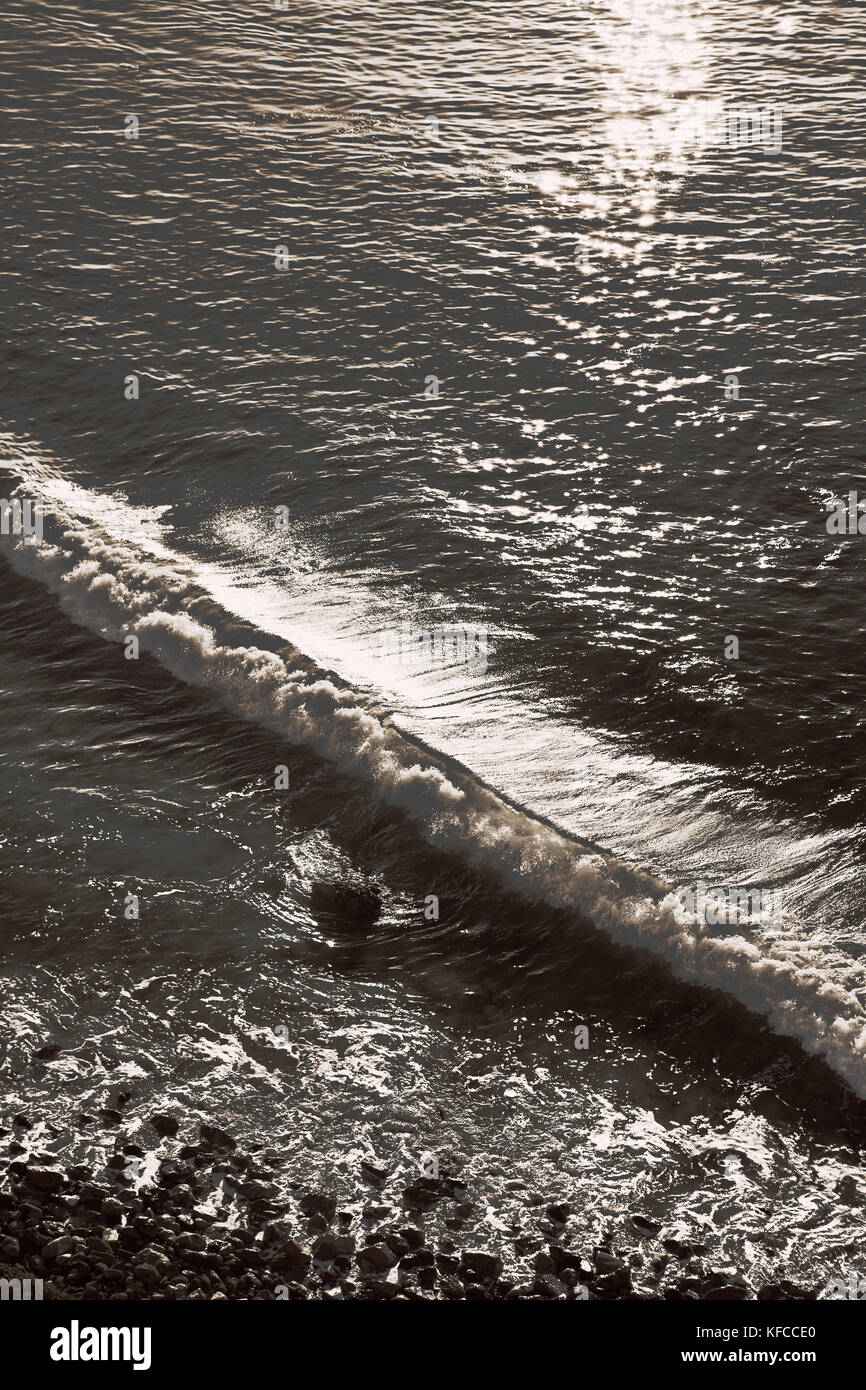 USA, California, Malibu, birds eye view of a wave breaking at Big Dume ...