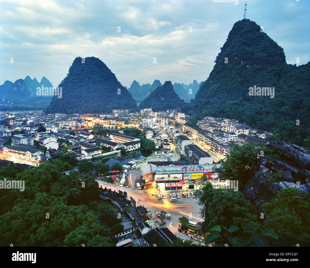 CHINA, Guilin, elevated view of Guilin and limestone spires at dusk ...