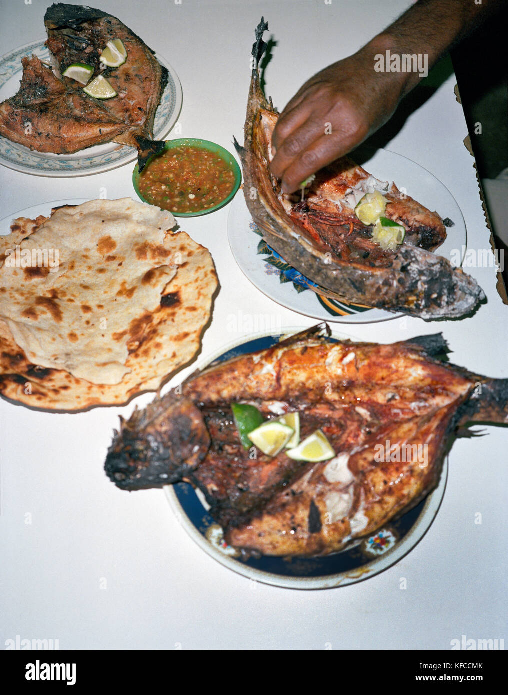 ERITREA, Massawa, a dinner of fresh fish by the Red Sea Stock Photo - Alamy