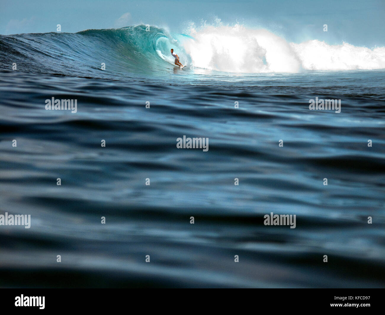 INDONESIA, Mentawai Islands, Kandui Resort, surfing a wave at ...