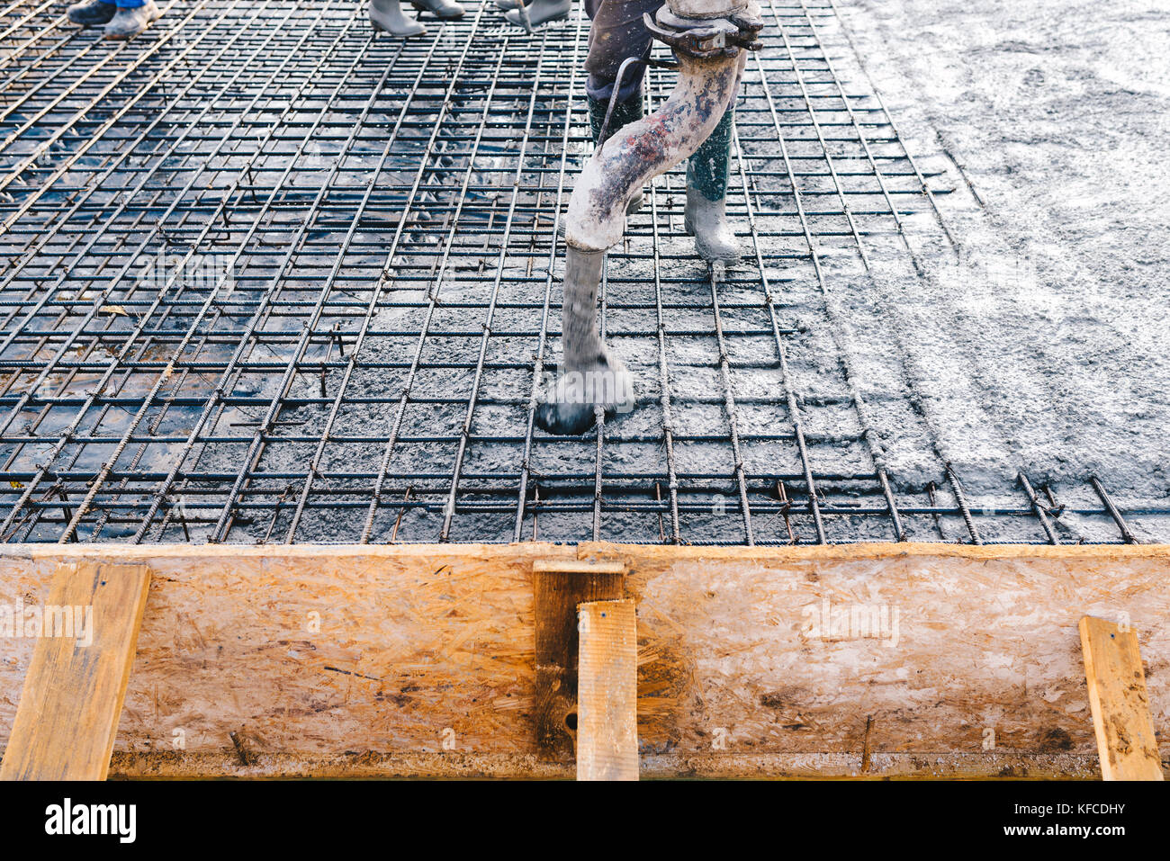 Concrete pouring during commercial concreting floors of buildings in ...