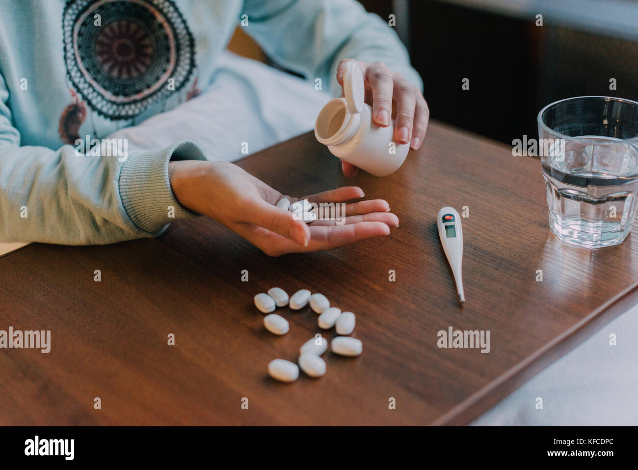 sick person taking medicine Stock Photo - Alamy