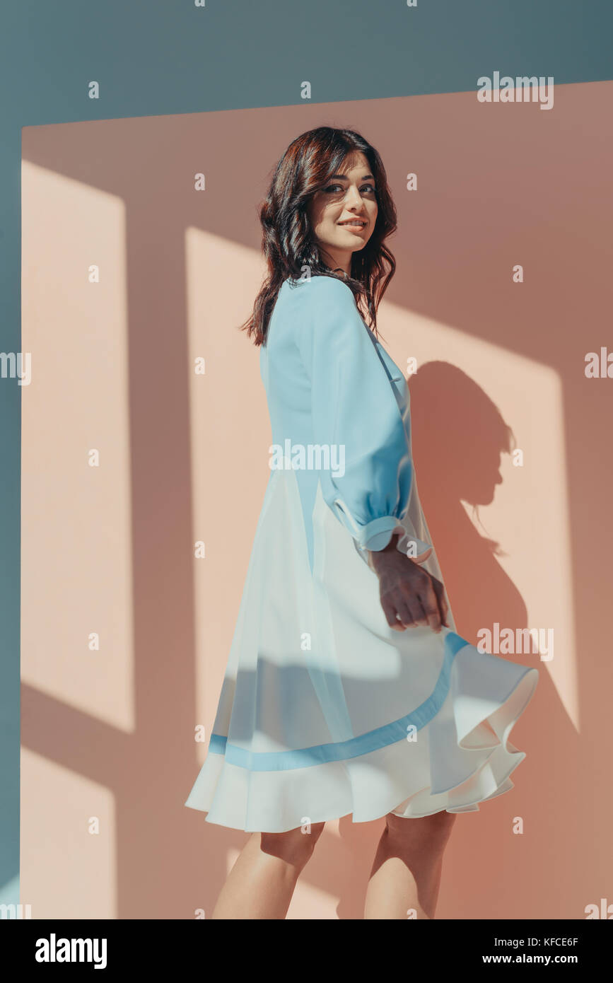 Woman in fashionable turquoise dress Stock Photo - Alamy