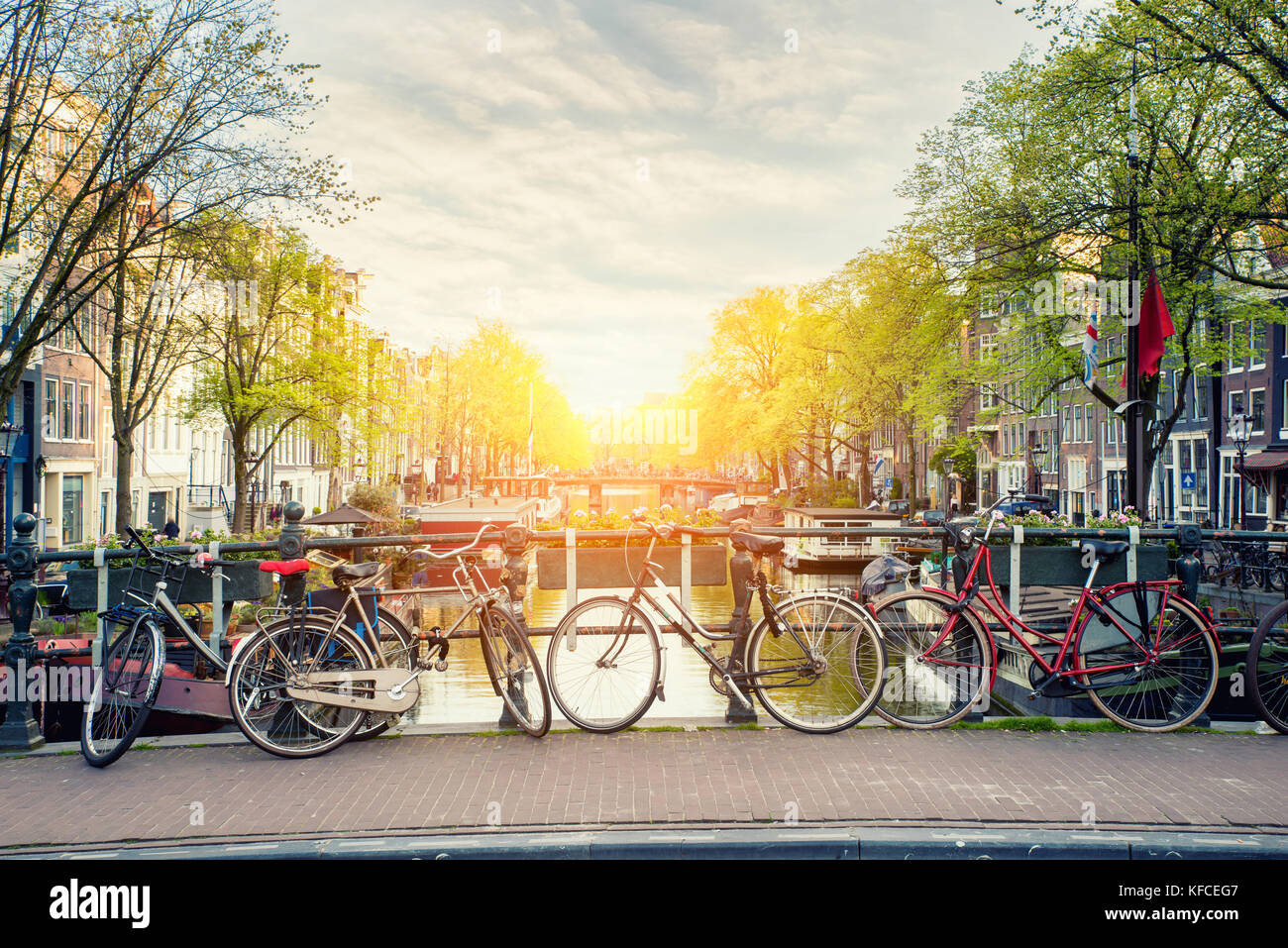 Bicycle on the bridge with Netherlands traditional houses and Amsterdam canal in Amsterdam ...