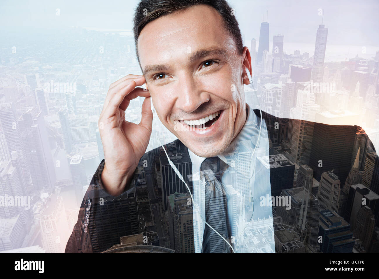 Happy cheerful man listening to music Stock Photo - Alamy