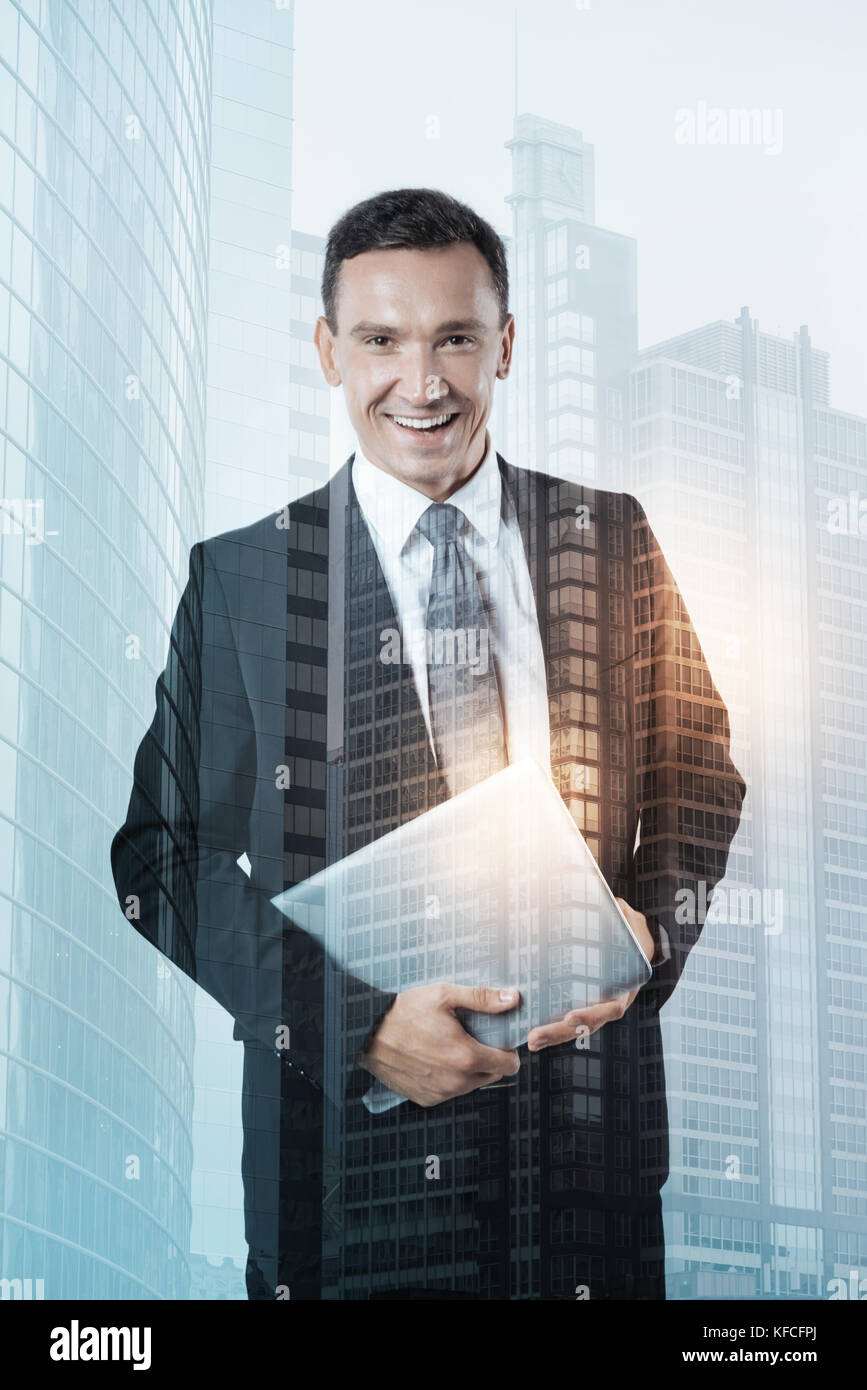 Cheerful delighted businessman smiling Stock Photo - Alamy