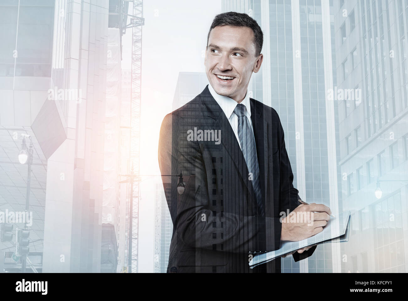 Positive smart businessman holding notes Stock Photo - Alamy