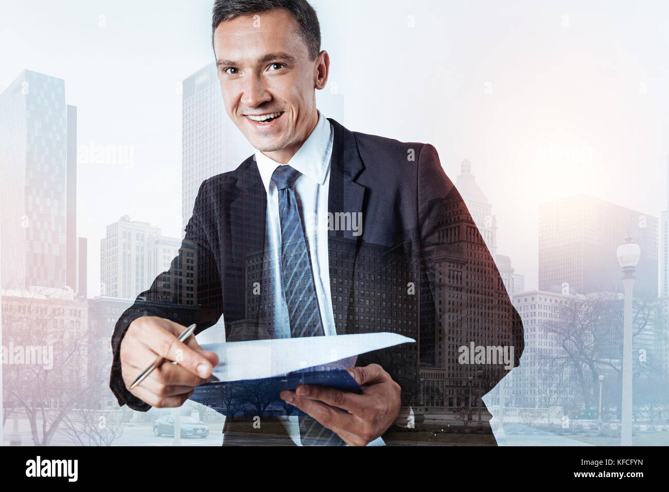 Delighted cheerful businessman working Stock Photo - Alamy