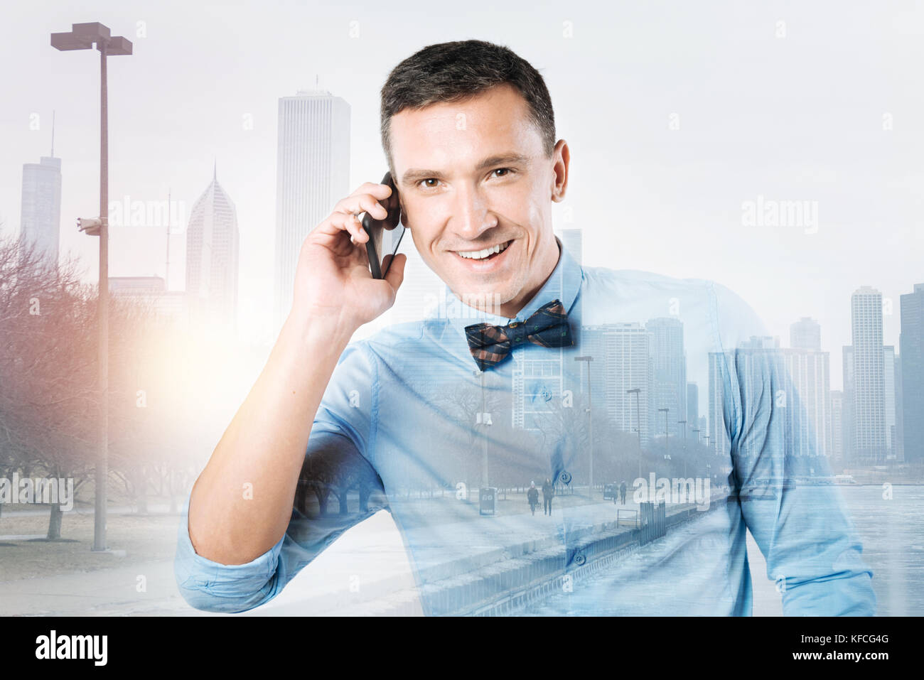 Joyful nice man making a phone call Stock Photo - Alamy