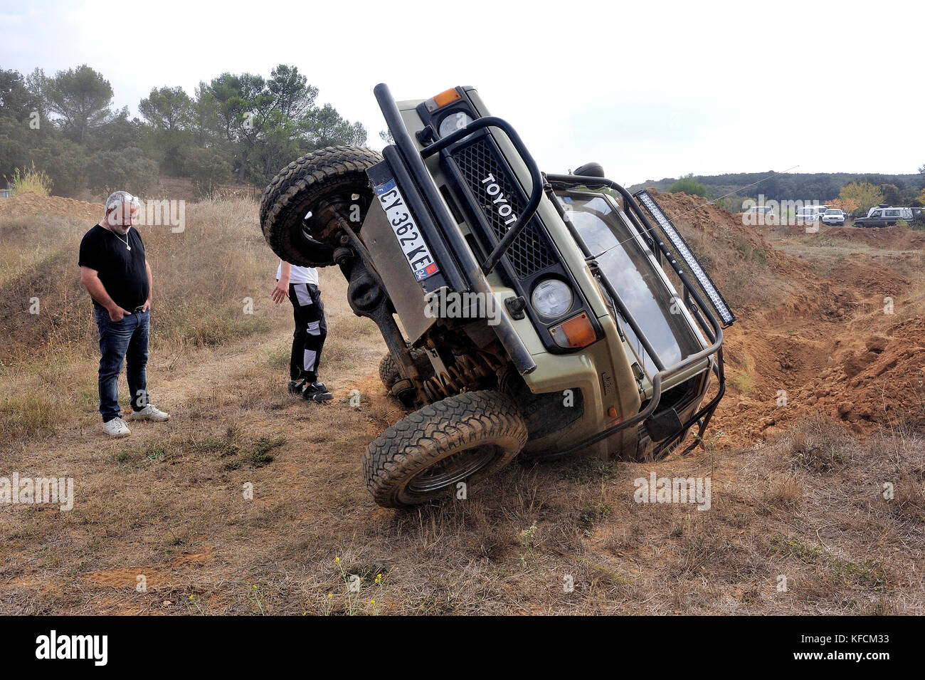 All-terrain car lying on the side after a risky and retightened ...