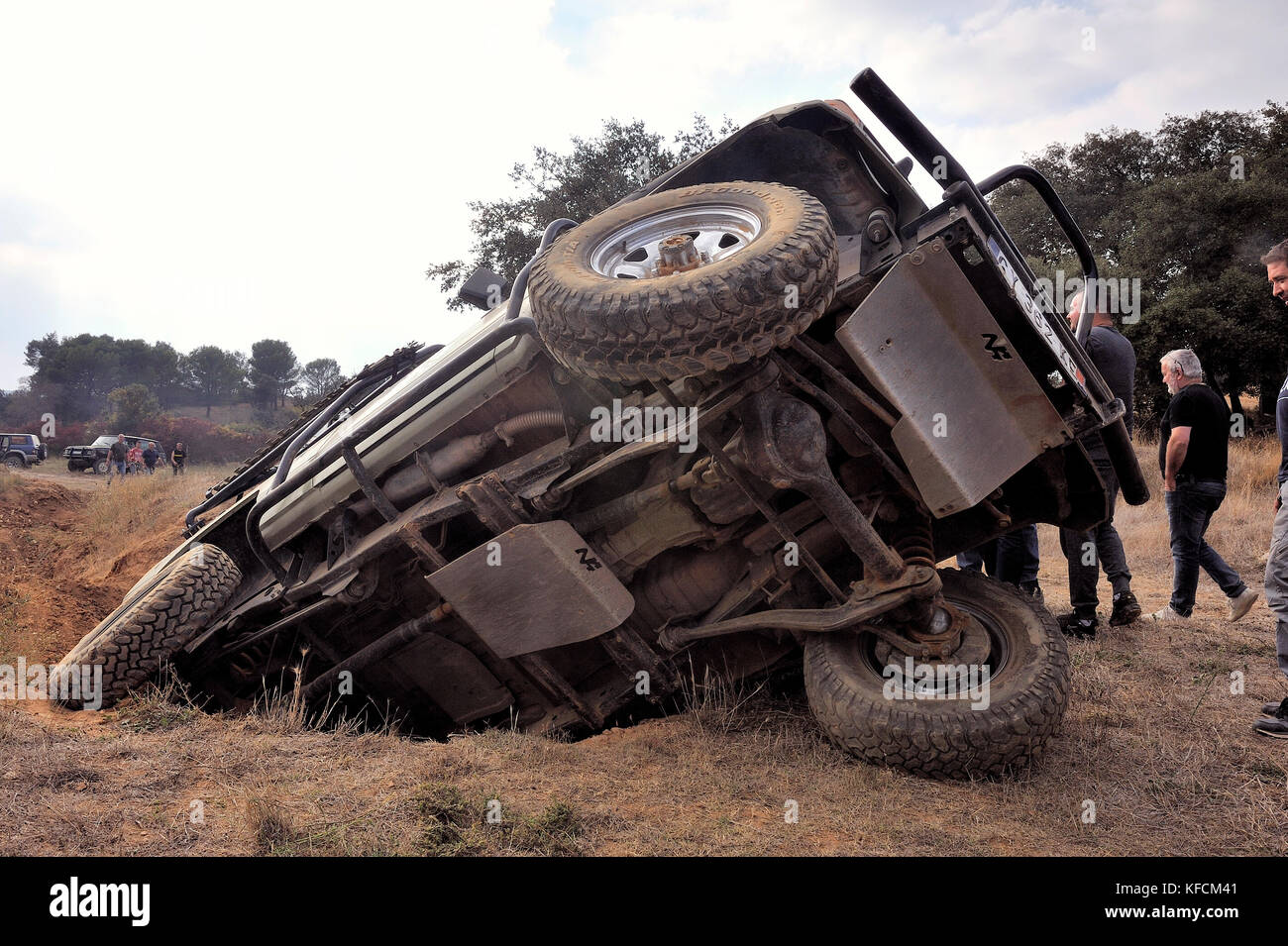 All-terrain car lying on the side after a risky and retightened ...