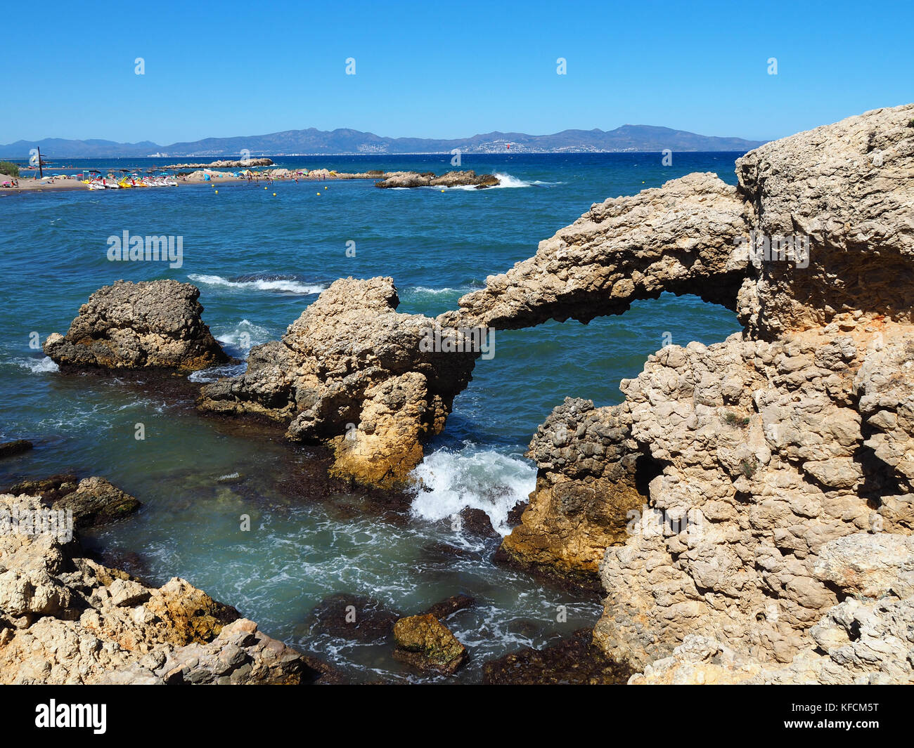 View of the natural arch of the beach of Portitxol in L'Escala, Costa ...