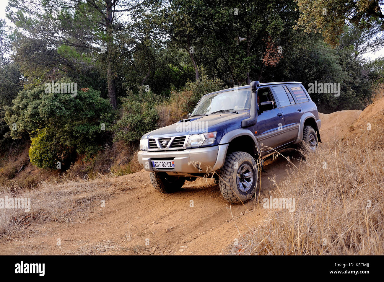 A Nissan Patrol in action in the dirt roads of a trial track Stock ...