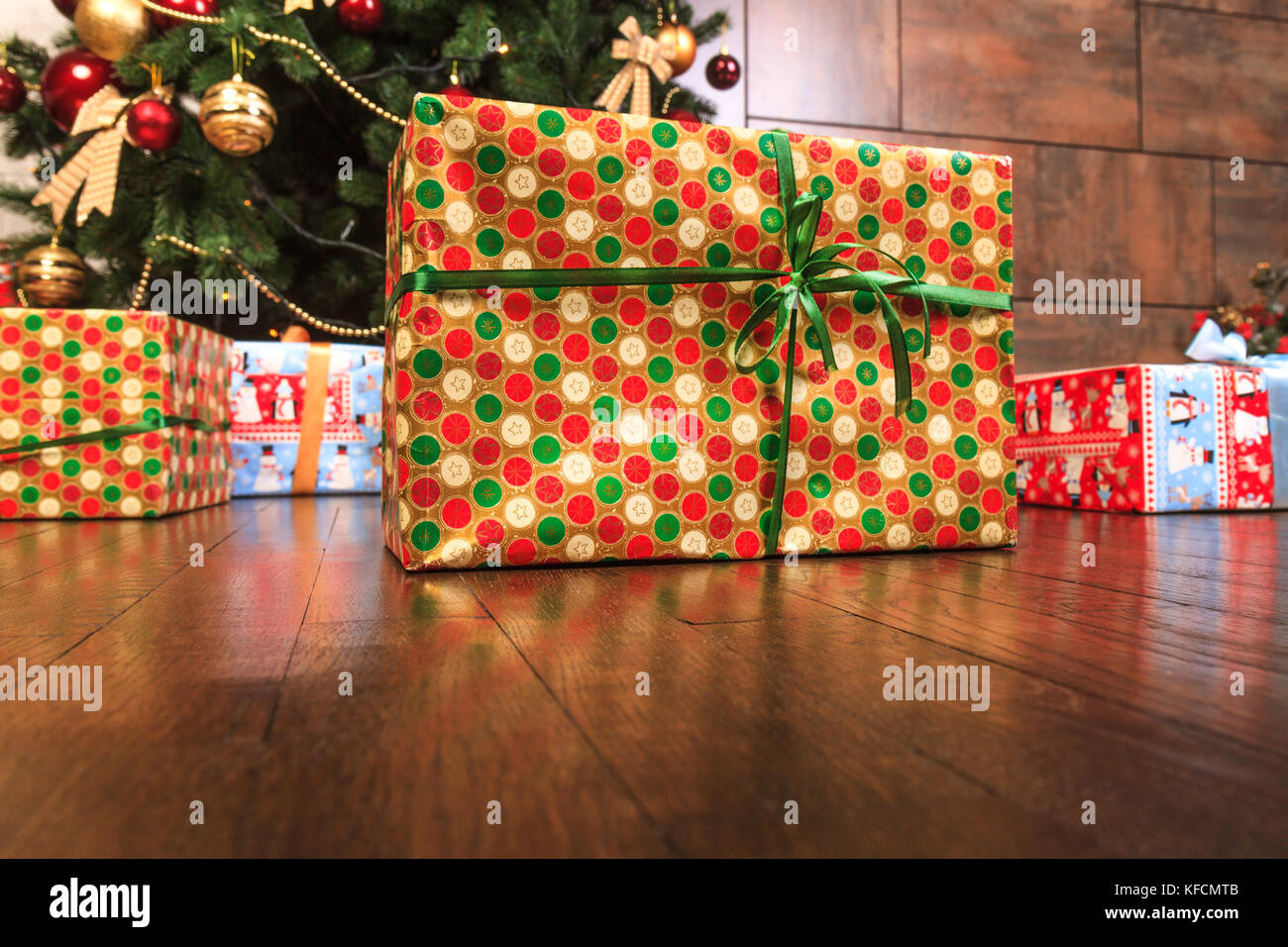 box with a gift under the Christmas tree Stock Photo - Alamy