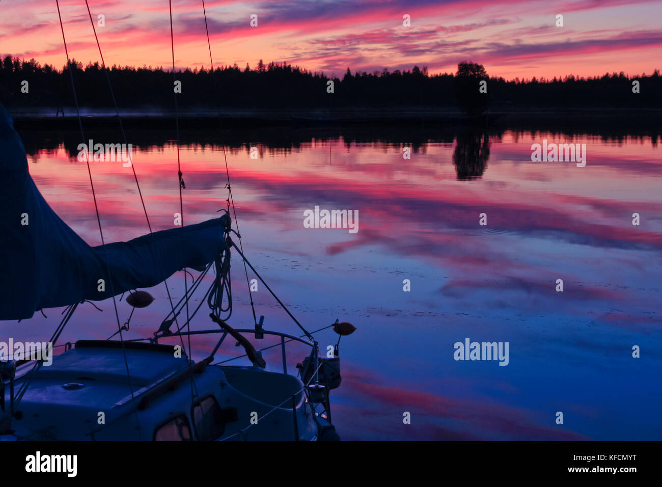 Nordic night with Nordic light in June and July. Sailboat this side ...