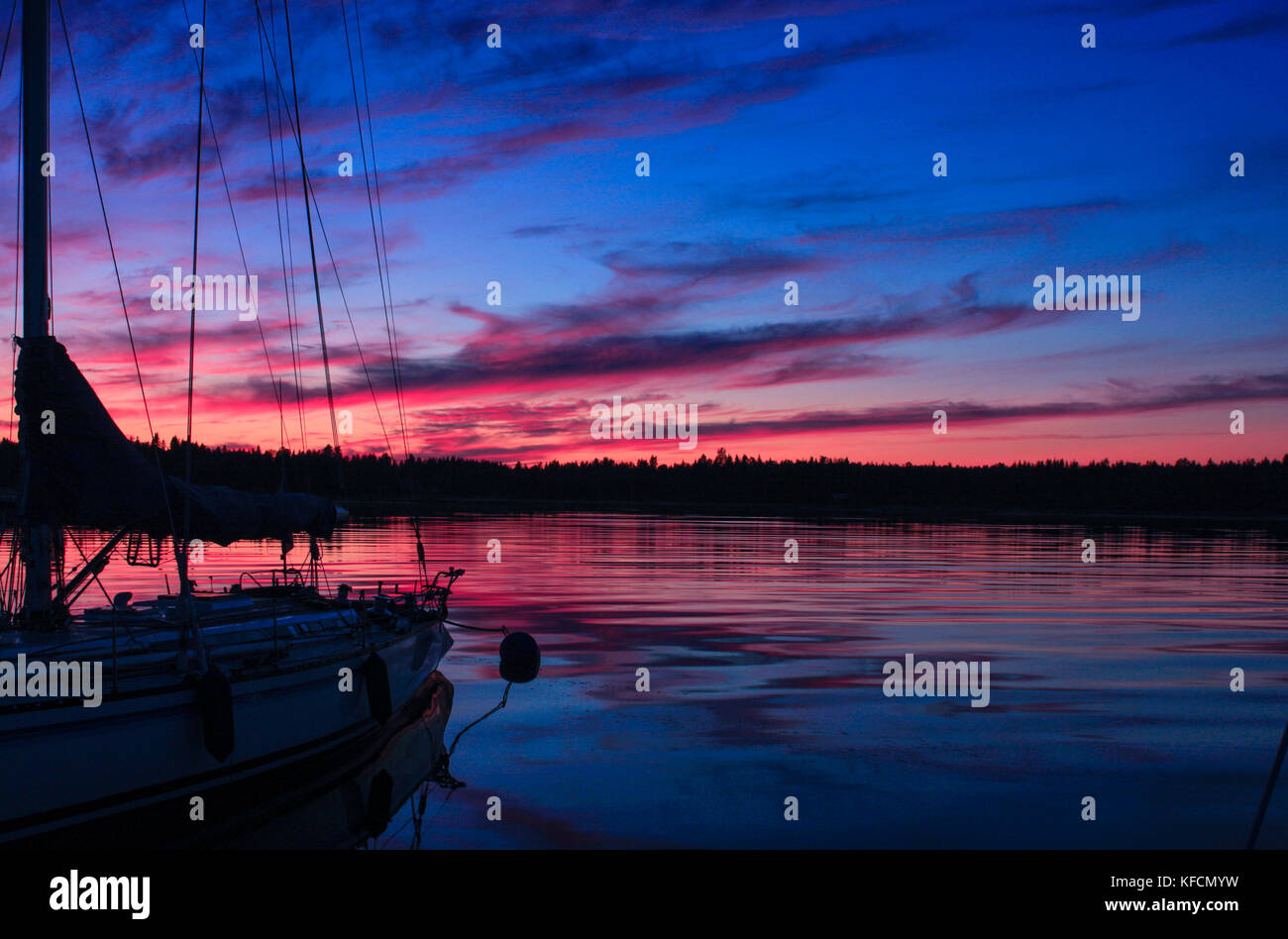 Nordic night with Nordic light in June and July. Sailboat this side ...