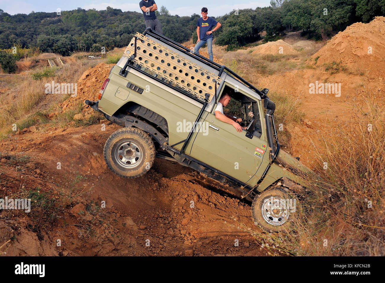 Large excavator digging hole sparks cars on trial grounds Stock Photo ...