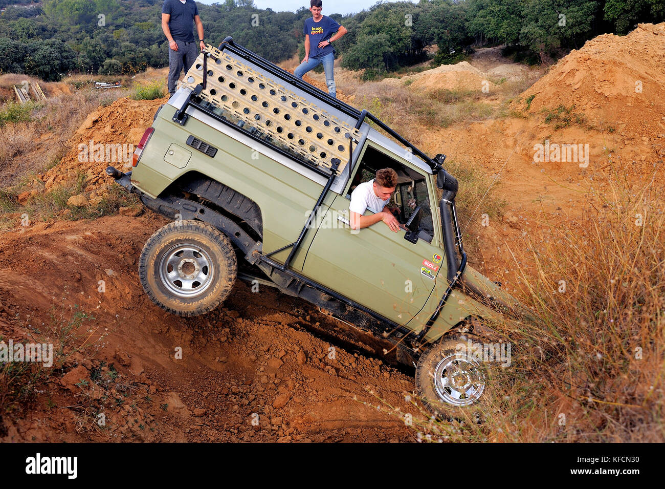 Large excavator digging hole sparks cars on trial grounds Stock Photo ...