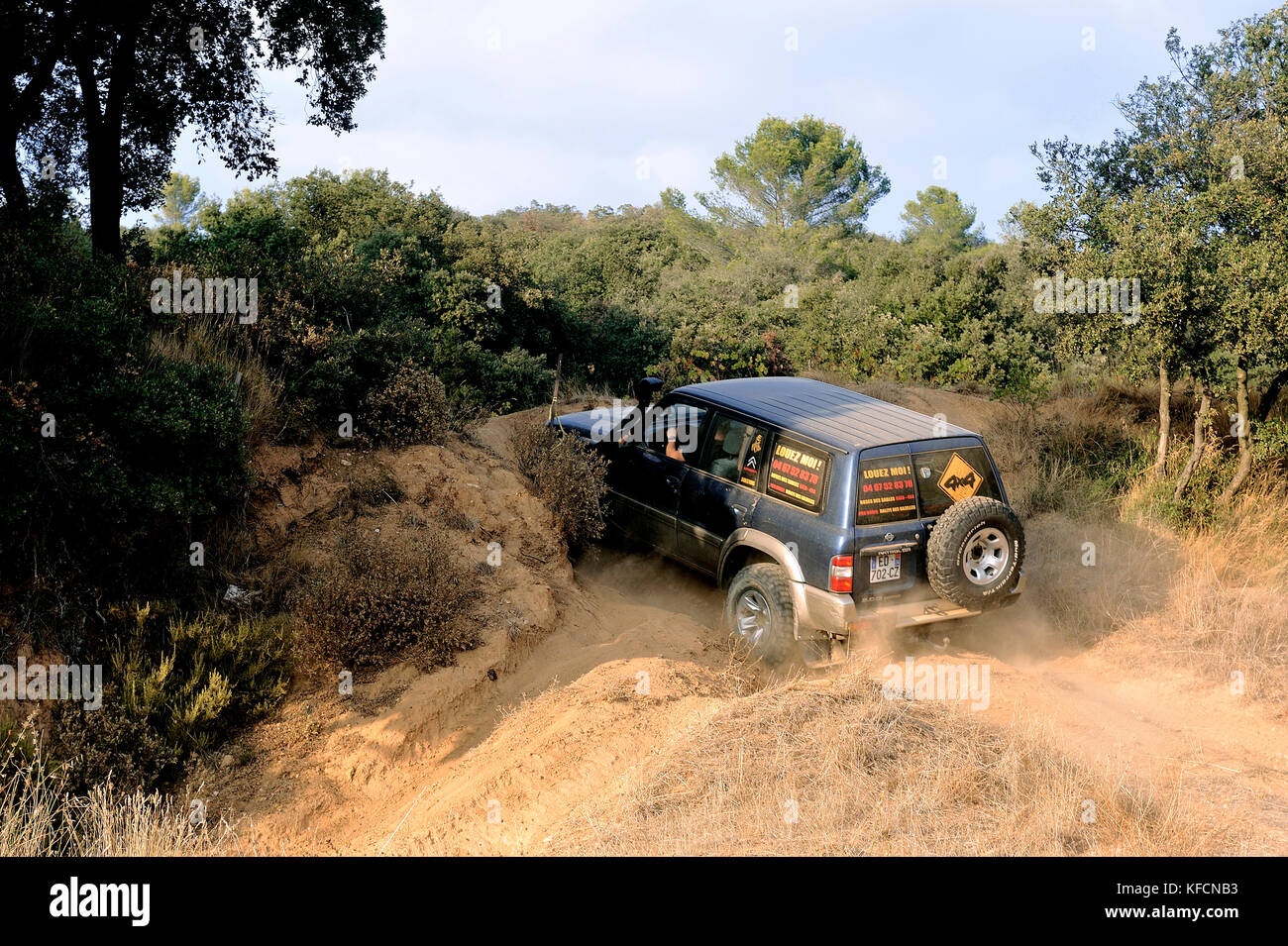A Nissan Patrol in action in the dirt roads of a trial track Stock ...