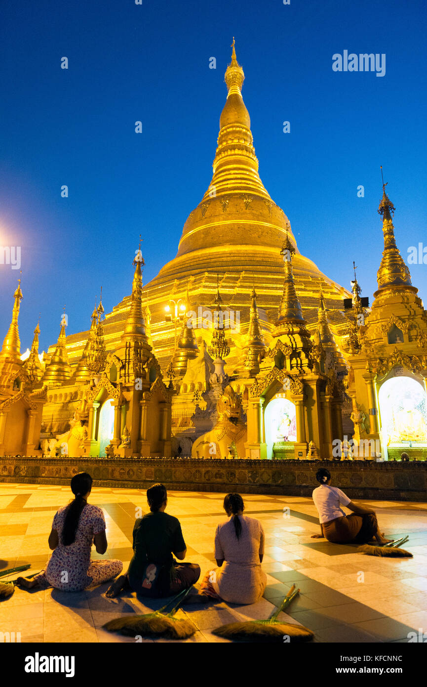 Myanmar (formerly Burma). Yangon. (Rangoon). Women praying at Shwedagon ...