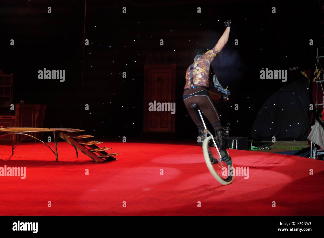 circus performers unicycle Stock Photo - Alamy