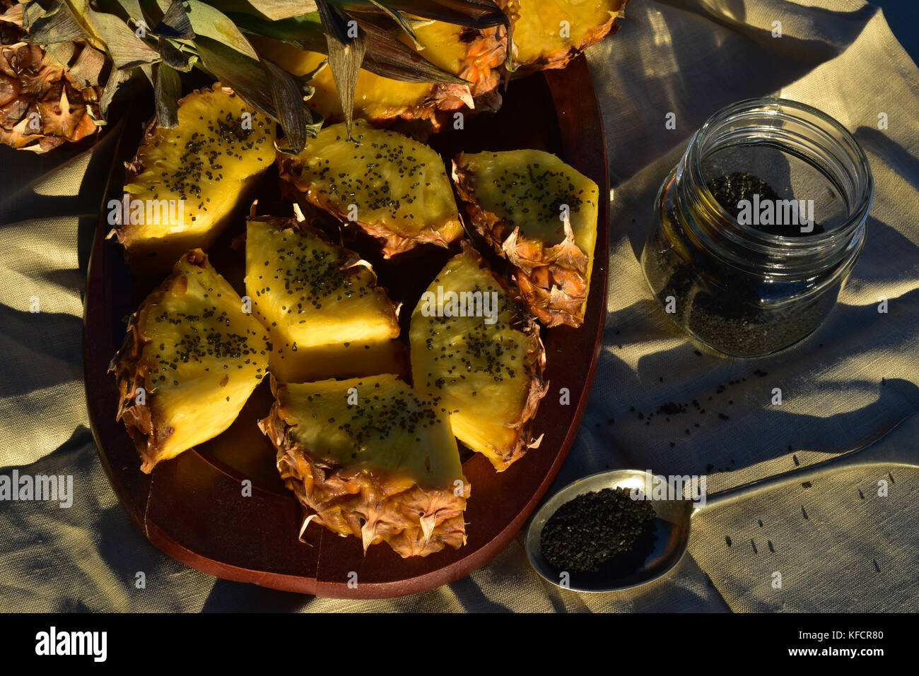 black Hawaiian salt on pineapple pieces Stock Photo - Alamy