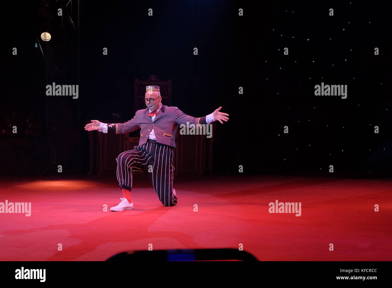 circus performers stripey trousers and hat Stock Photo - Alamy
