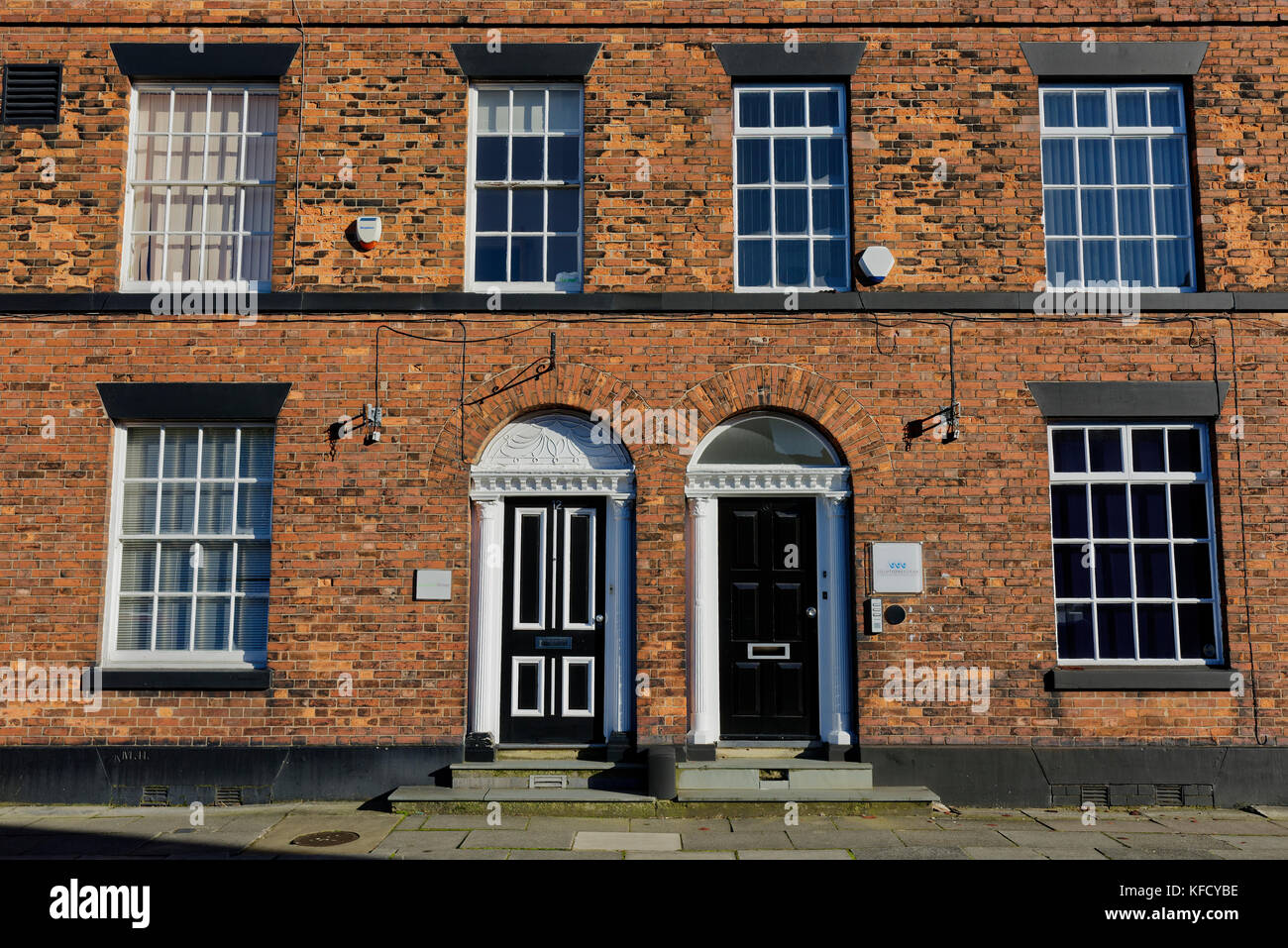 Two storey brick terrace of two bay houses in late georgian style ...