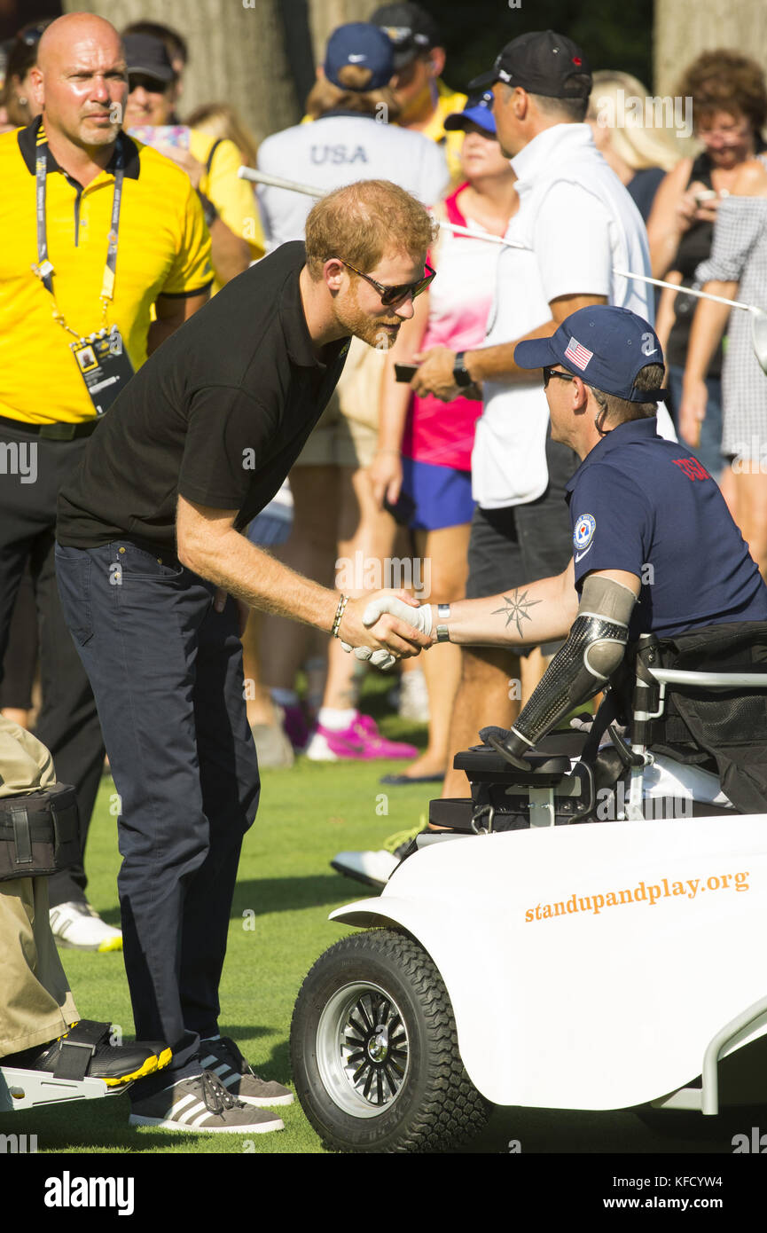 Prince Harry attends the Golf at St. George Golf Course as part of the ...